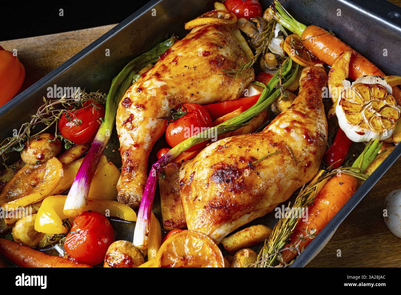 Roasted chicken legs with various vegetables Stock Photo - Alamy