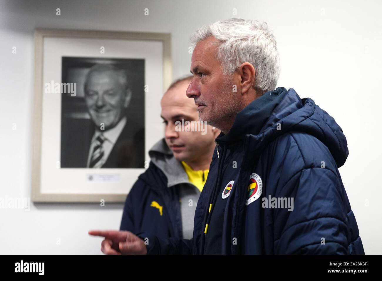 Fenerbahce manager Jose Mourinho walks past a picture of former Rangers ...