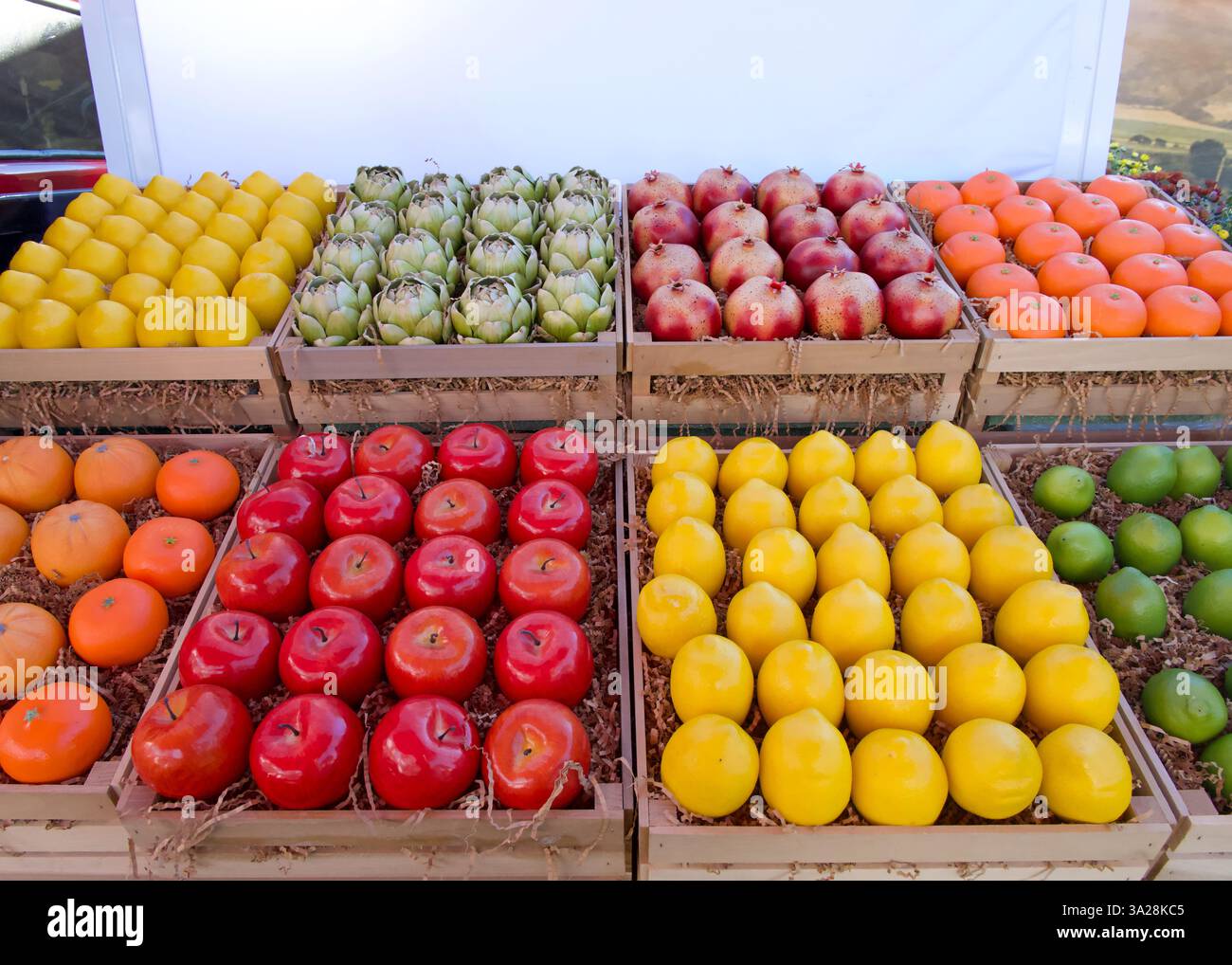 Fresh produce, fruits and vegetables, in display crates on the back of ...