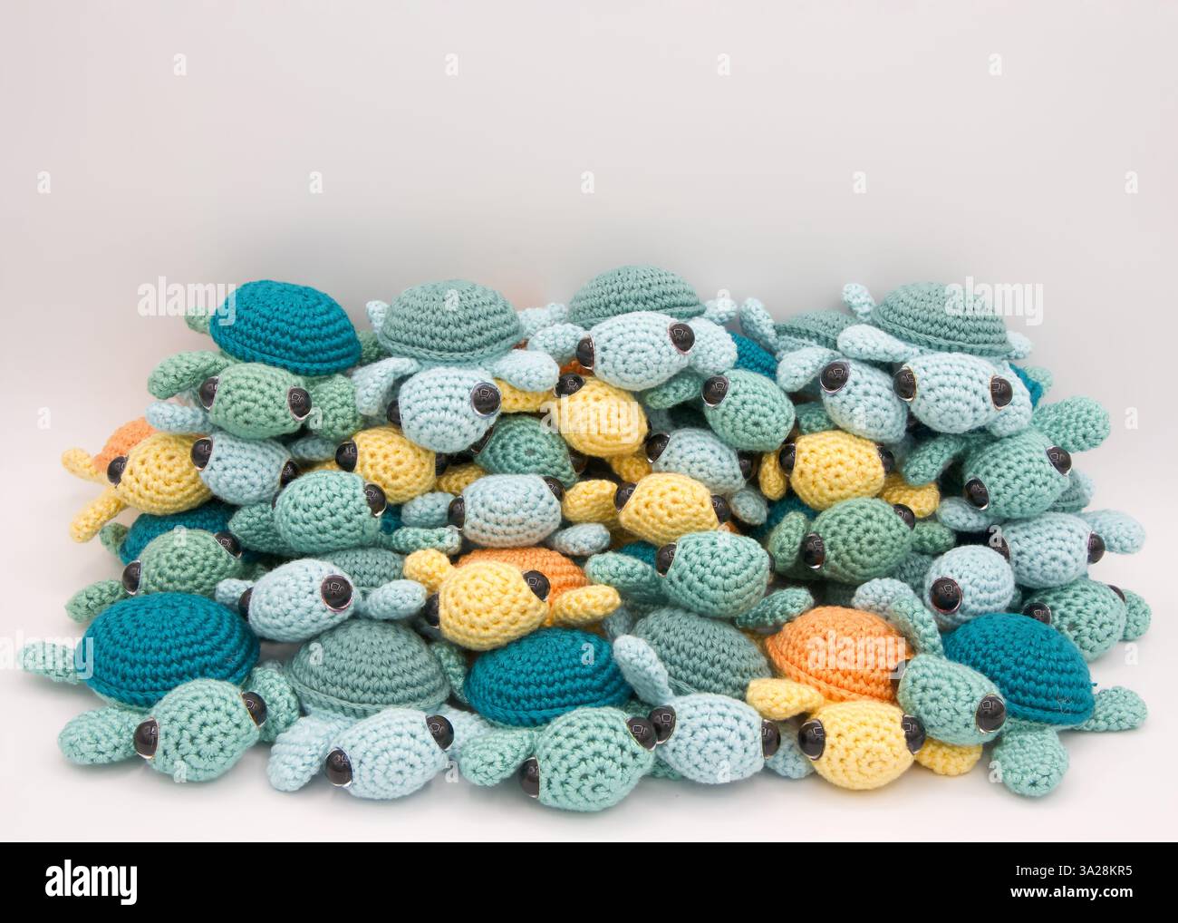 Pile of many handmade crochet turtles in green and turquoise, yellow ...