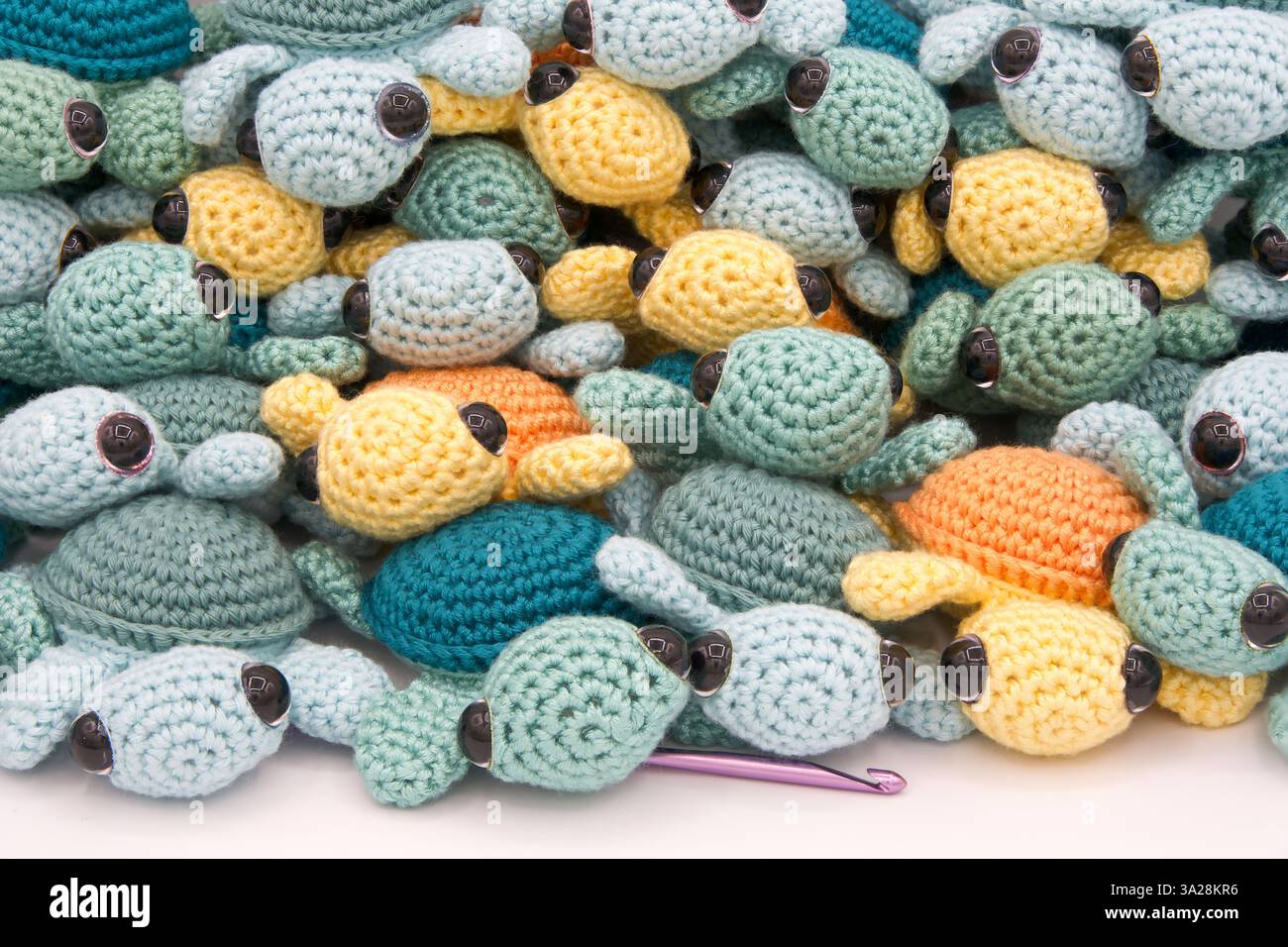 Pile of many handmade crochet turtles in green and turquoise, yellow ...