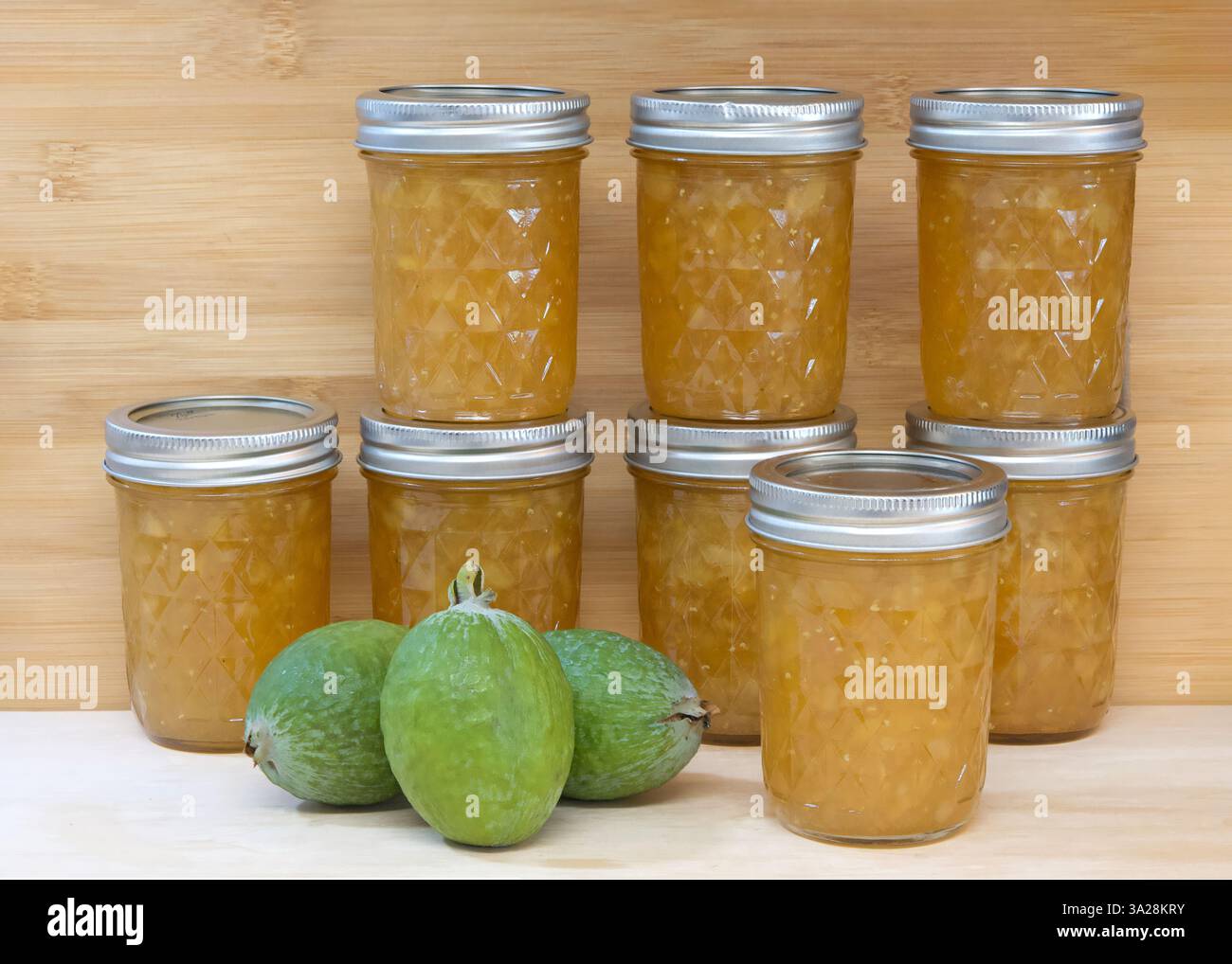 Close up on a jars of fresh homemade jam with fresh ripe Feijoa sellowiana also known as Acca ...