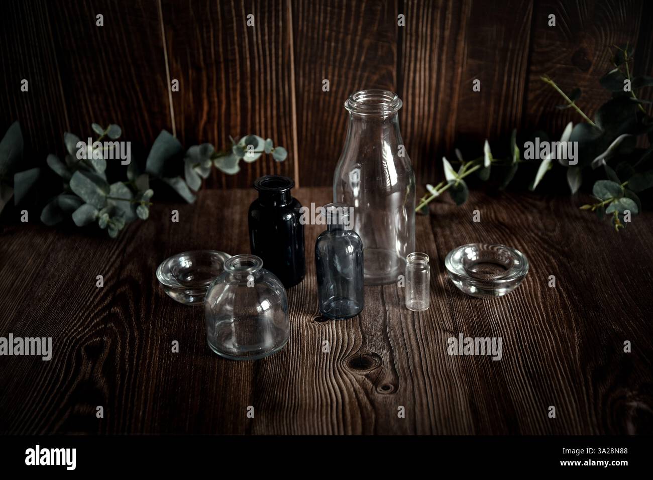 The photo shows various glass bottles and small bowls Stock Photo - Alamy