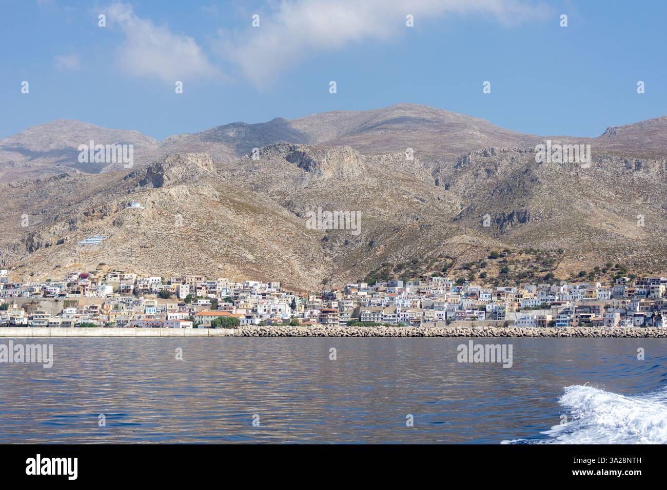 Pothia, at base of mountains capital city of Kalymnos from bay with ...
