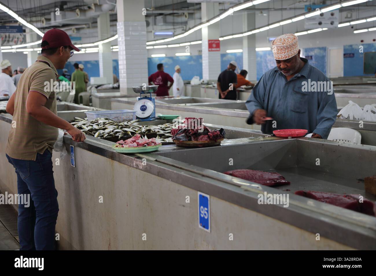 Omani Man Selling Fish at Mutrah Fish Souk Muscat Oman Stock Photo - Alamy