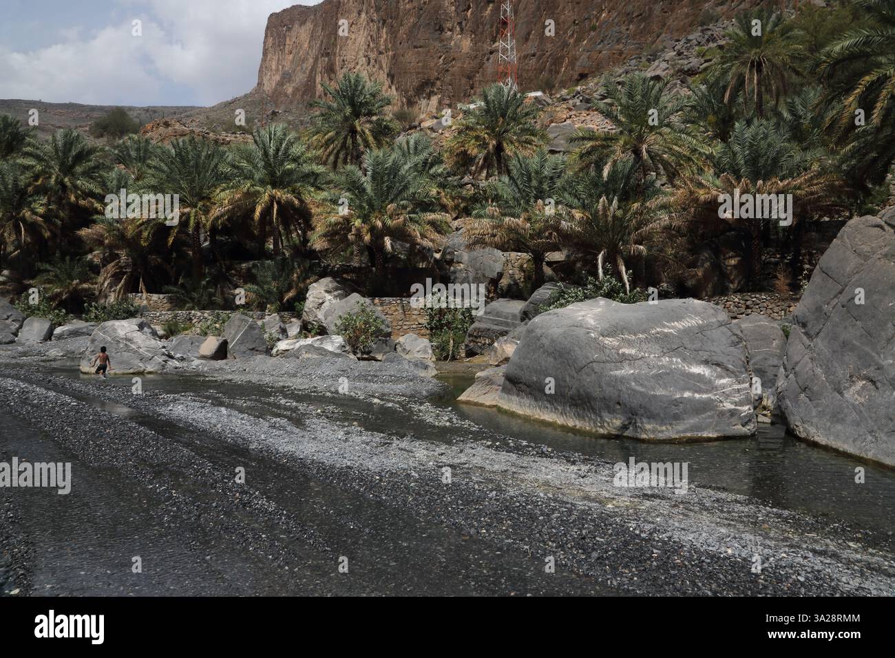 Boy in Wadi Ghul Hajar Mountains Al Hamra Oman Stock Photo - Alamy