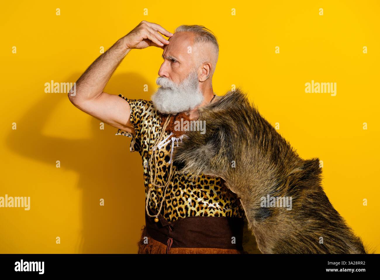 Photo of aged savage caveman wear leopard outfit animal skin look empty ...