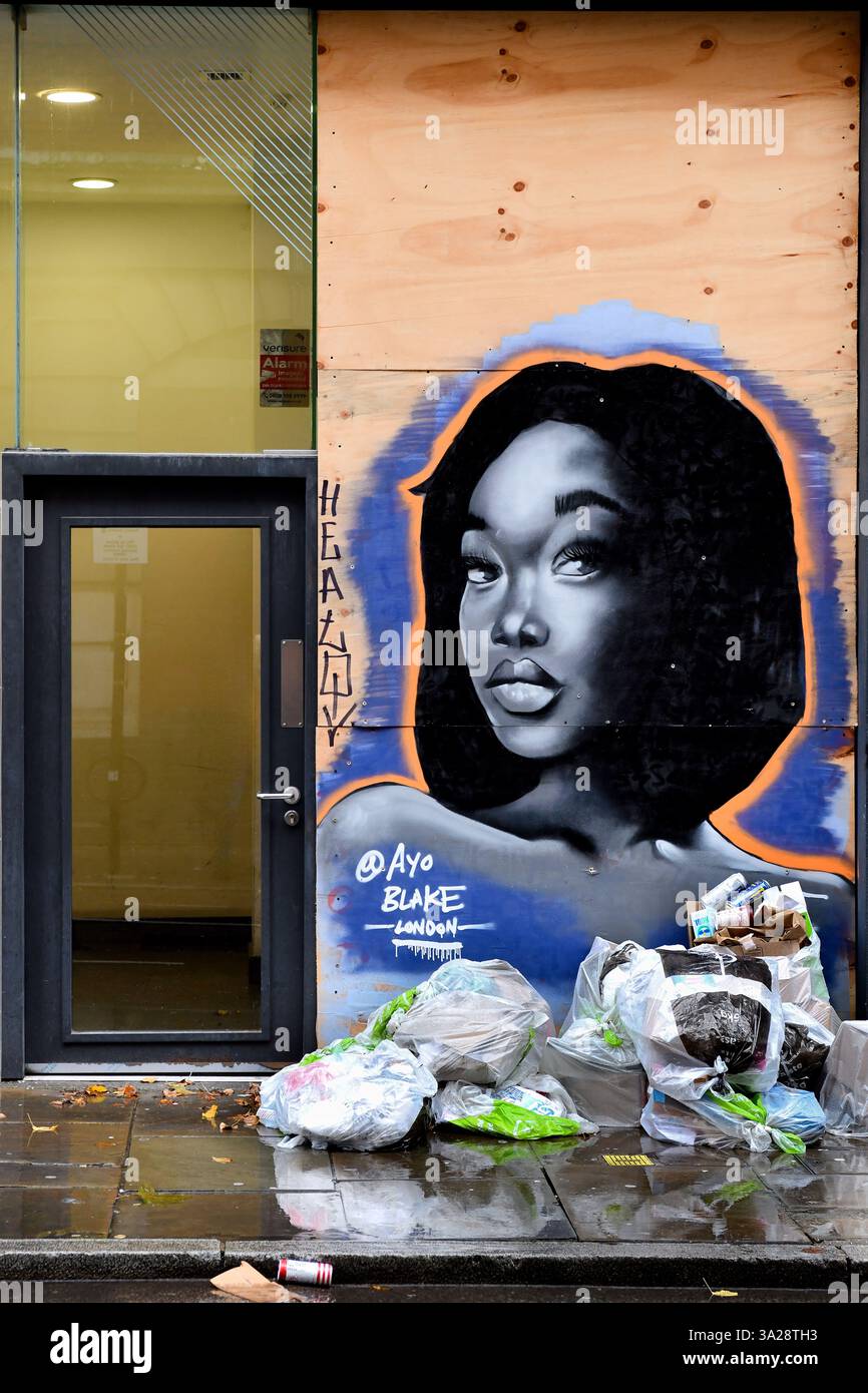 Boarded up office glass window with Ayo Bale portrait, Shoreditch ...