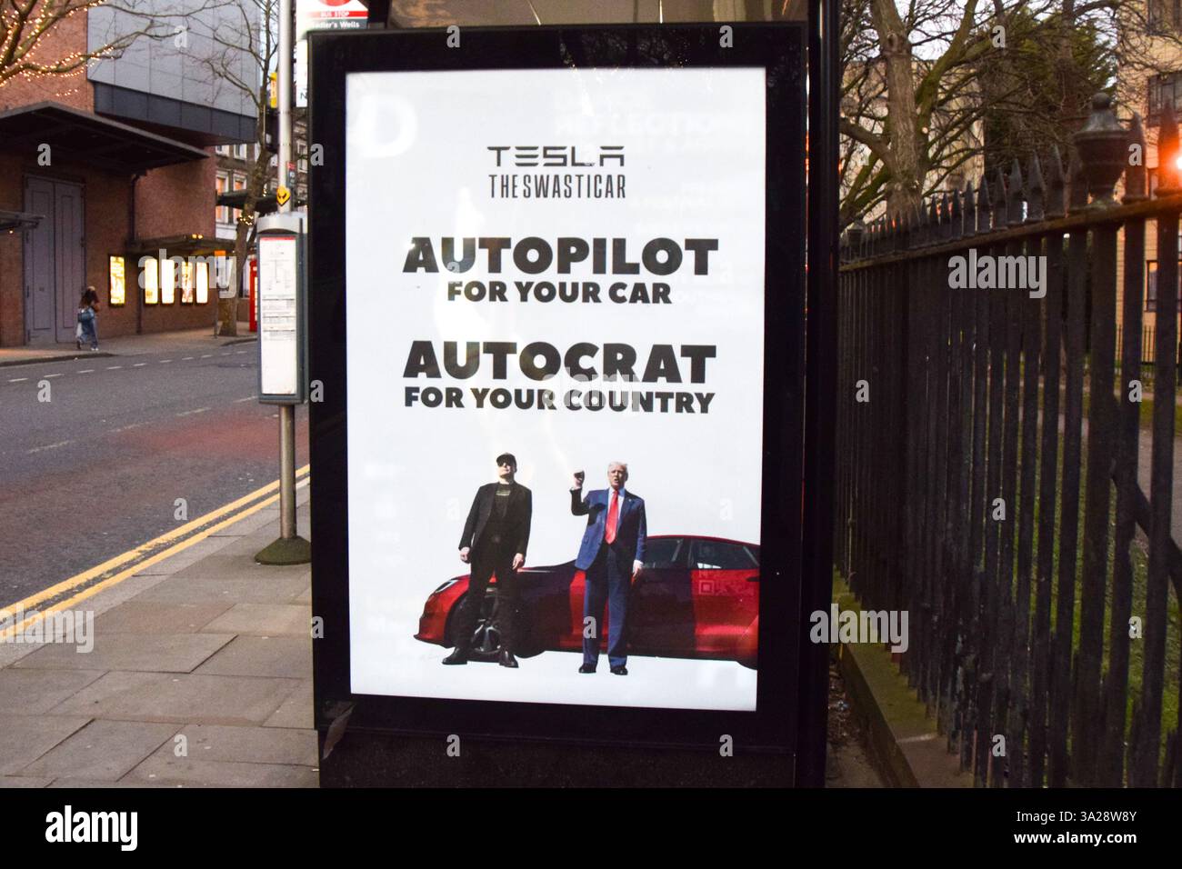 London, UK. 12th March 2025. A mock advert for 'Tesla The Swasticar ...