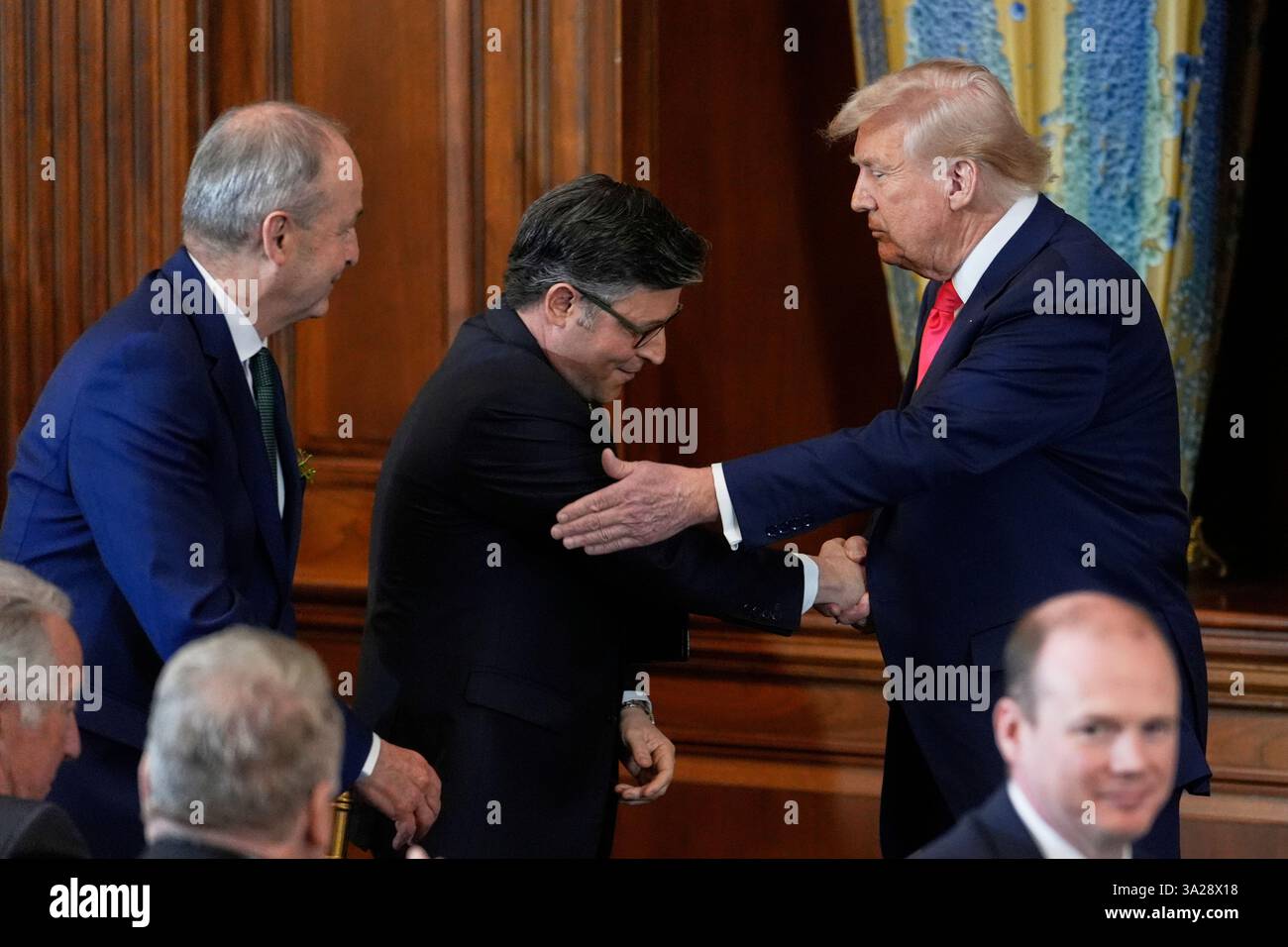 President Donald Trump greets House Speaker Mike Johnson of La., as ...