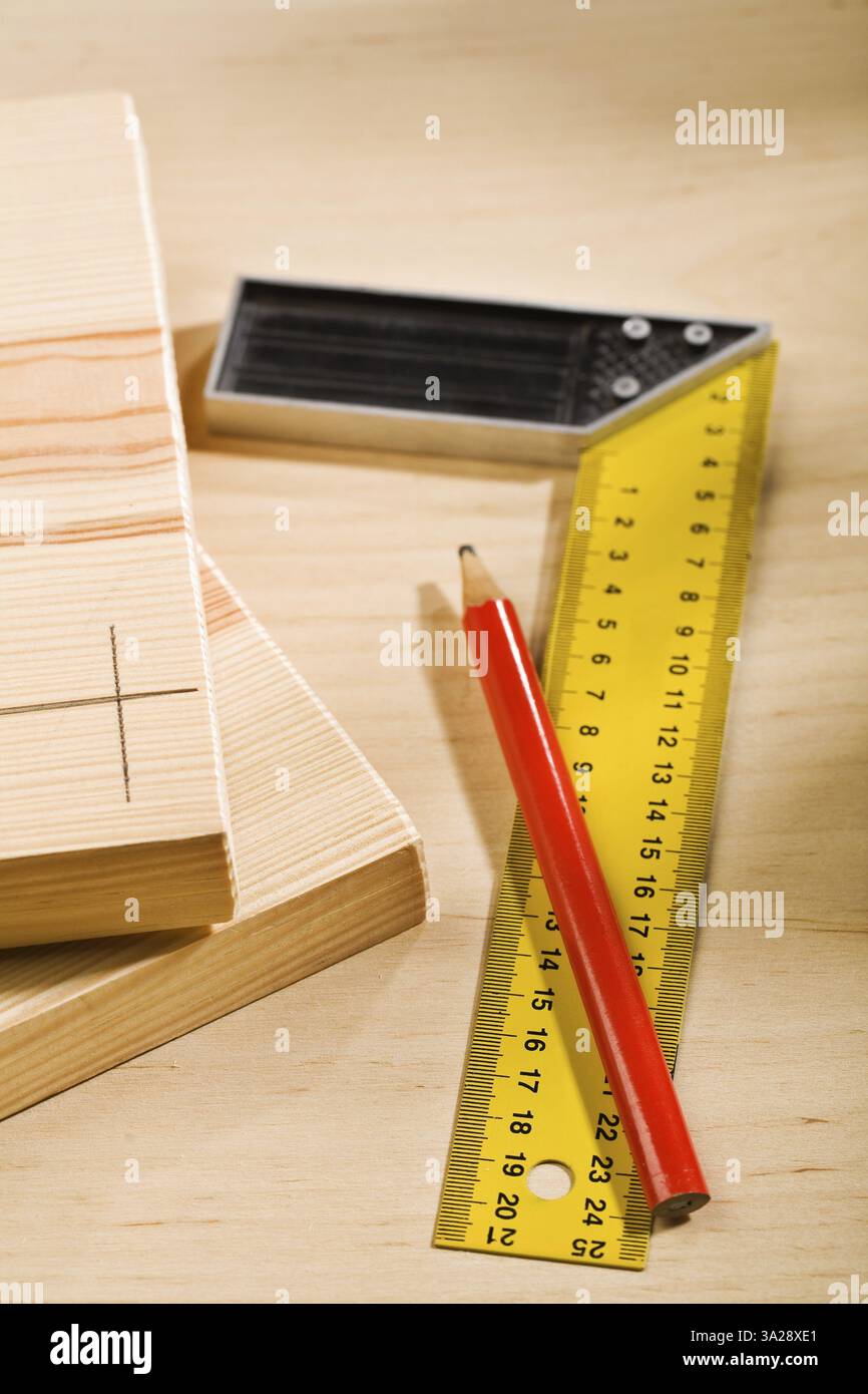 Set-square ruler and pencil with boards Stock Photo - Alamy