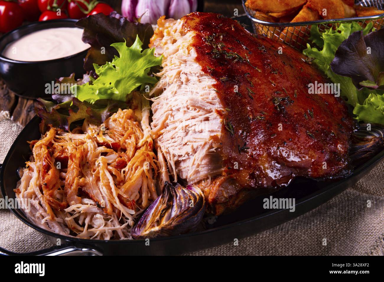 Delicious pulled pork with jacket potato quarters Stock Photo - Alamy