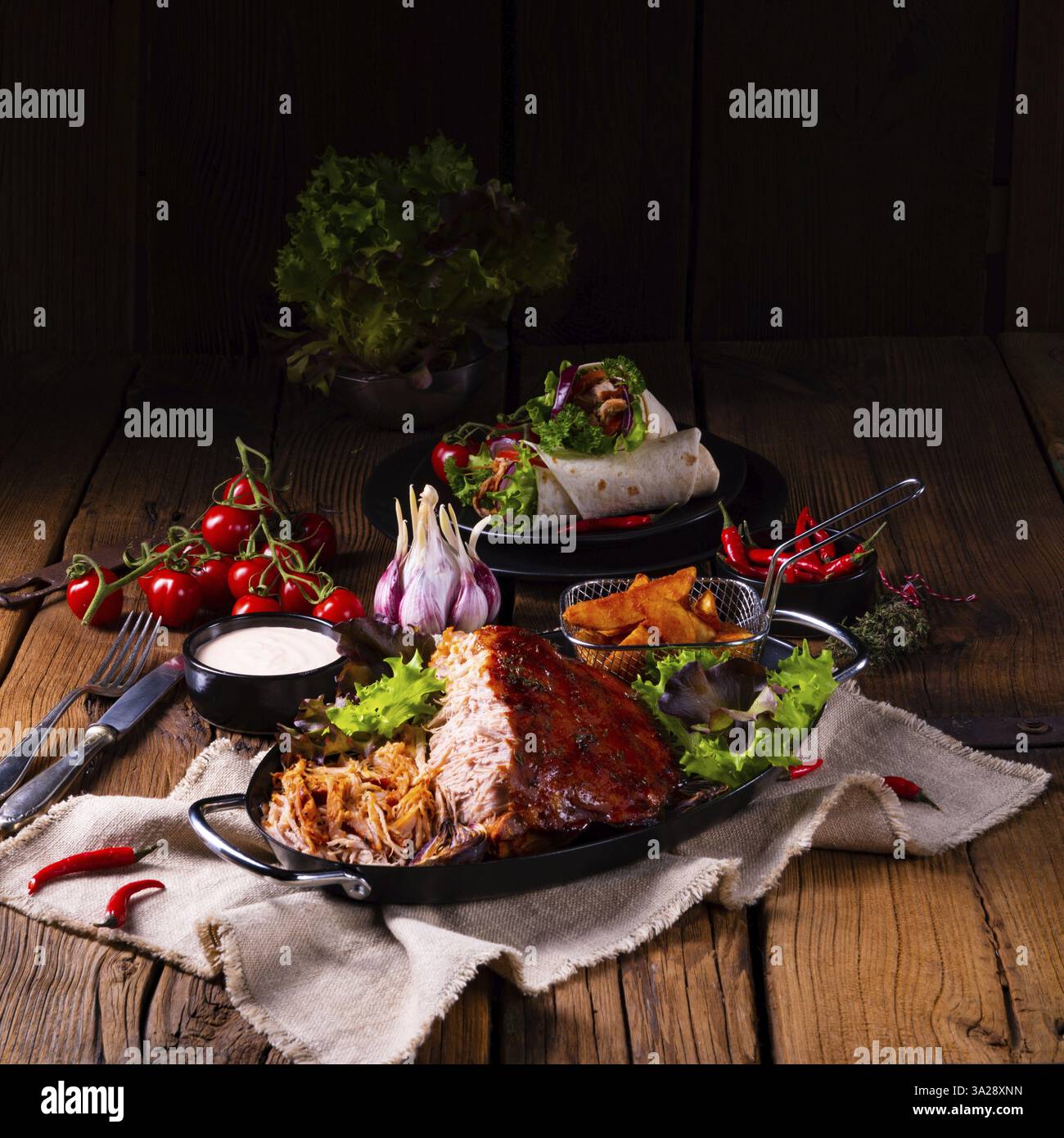 Delicious pulled pork with jacket potato quarters Stock Photo - Alamy