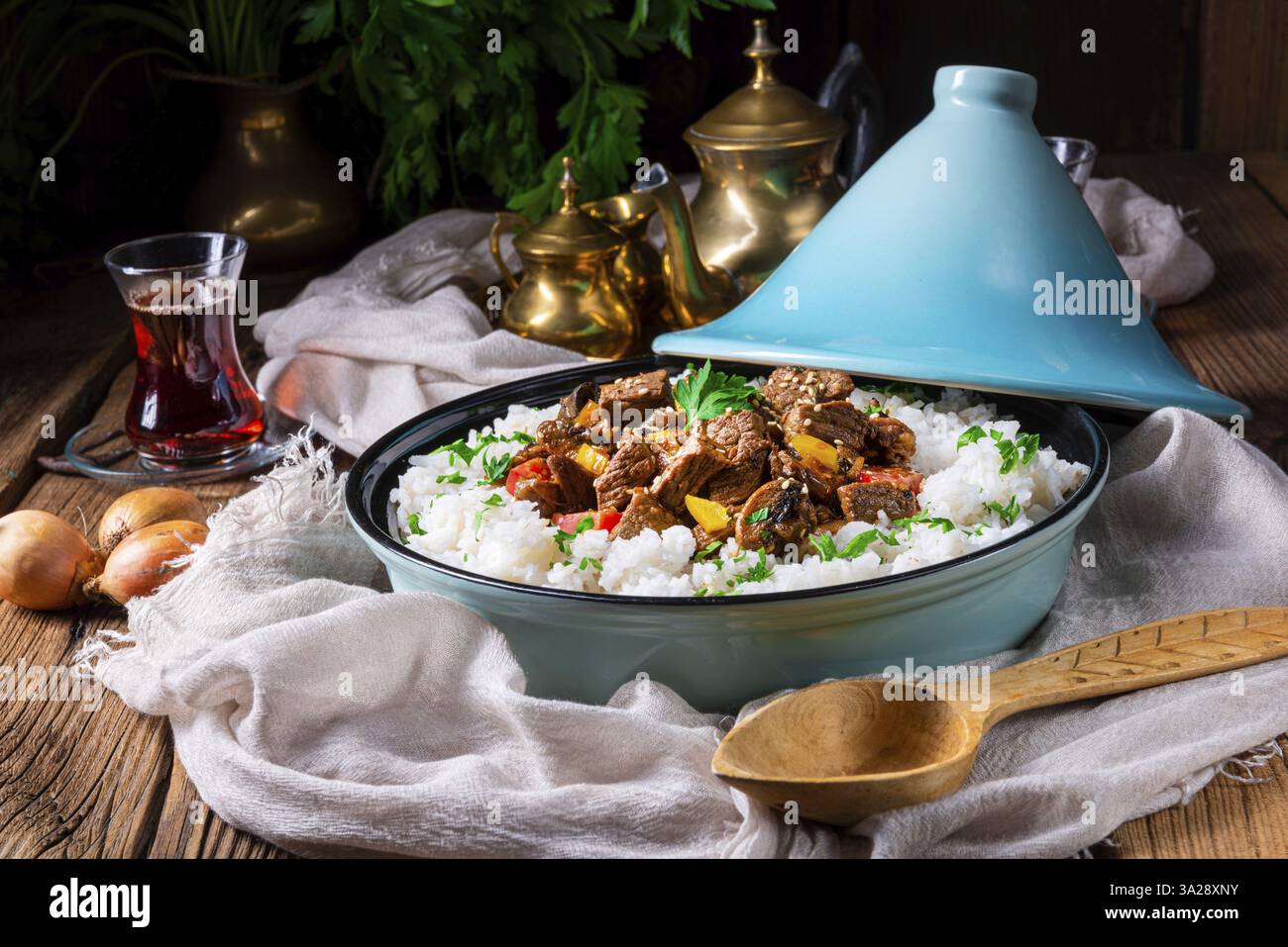 Tajin beef stew with rice, peppers and sesame seeds Stock Photo - Alamy