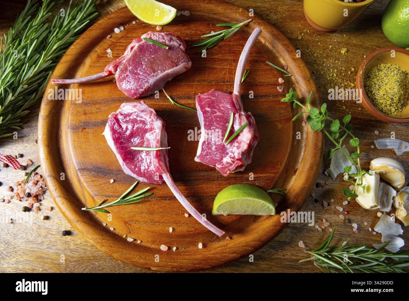 Raw fresh lamb chops Wooden chopping board Stock Photo - Alamy