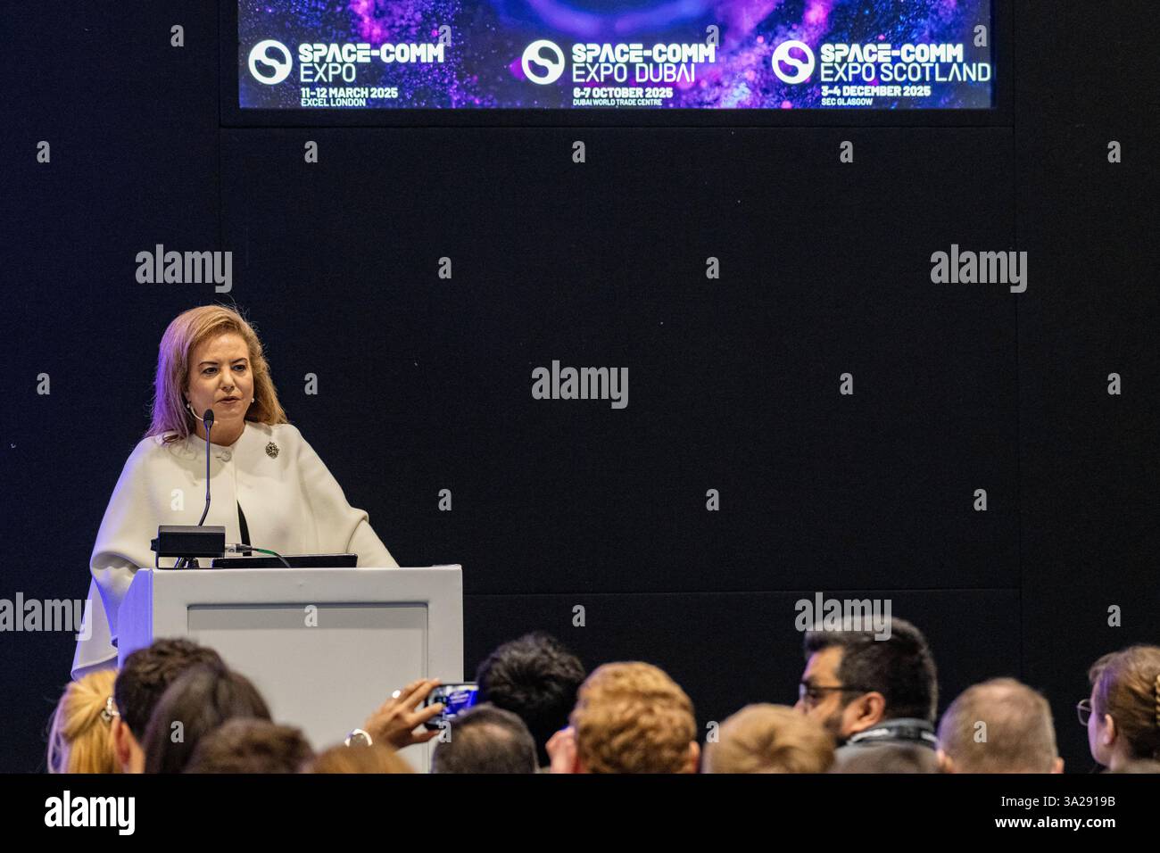 Professor Emma Edhem introducing and welcoming an audience at the ...