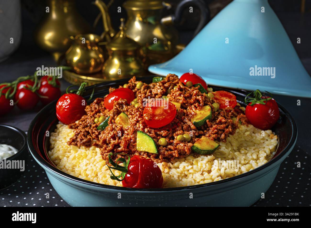Tomato bulgur with vegetables and minced meat Stock Photo - Alamy