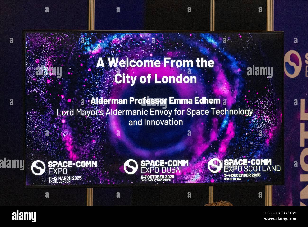 A tv screen showing the welcome from the city of London from Professor Emma Edham at the Space ...