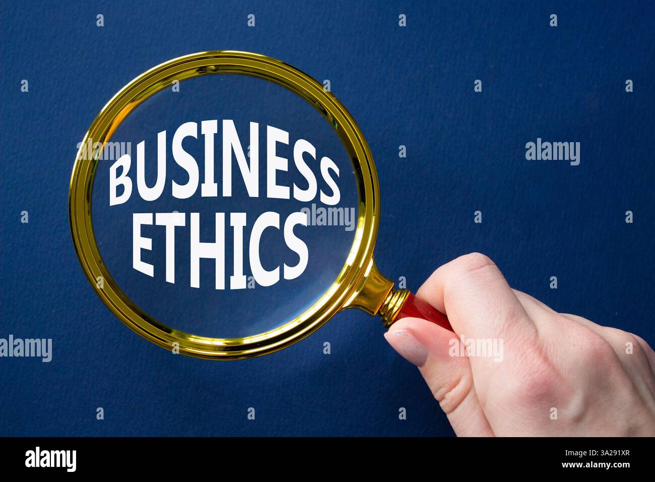 Business ethics symbol. Concept word Business ethics on magnifying ...