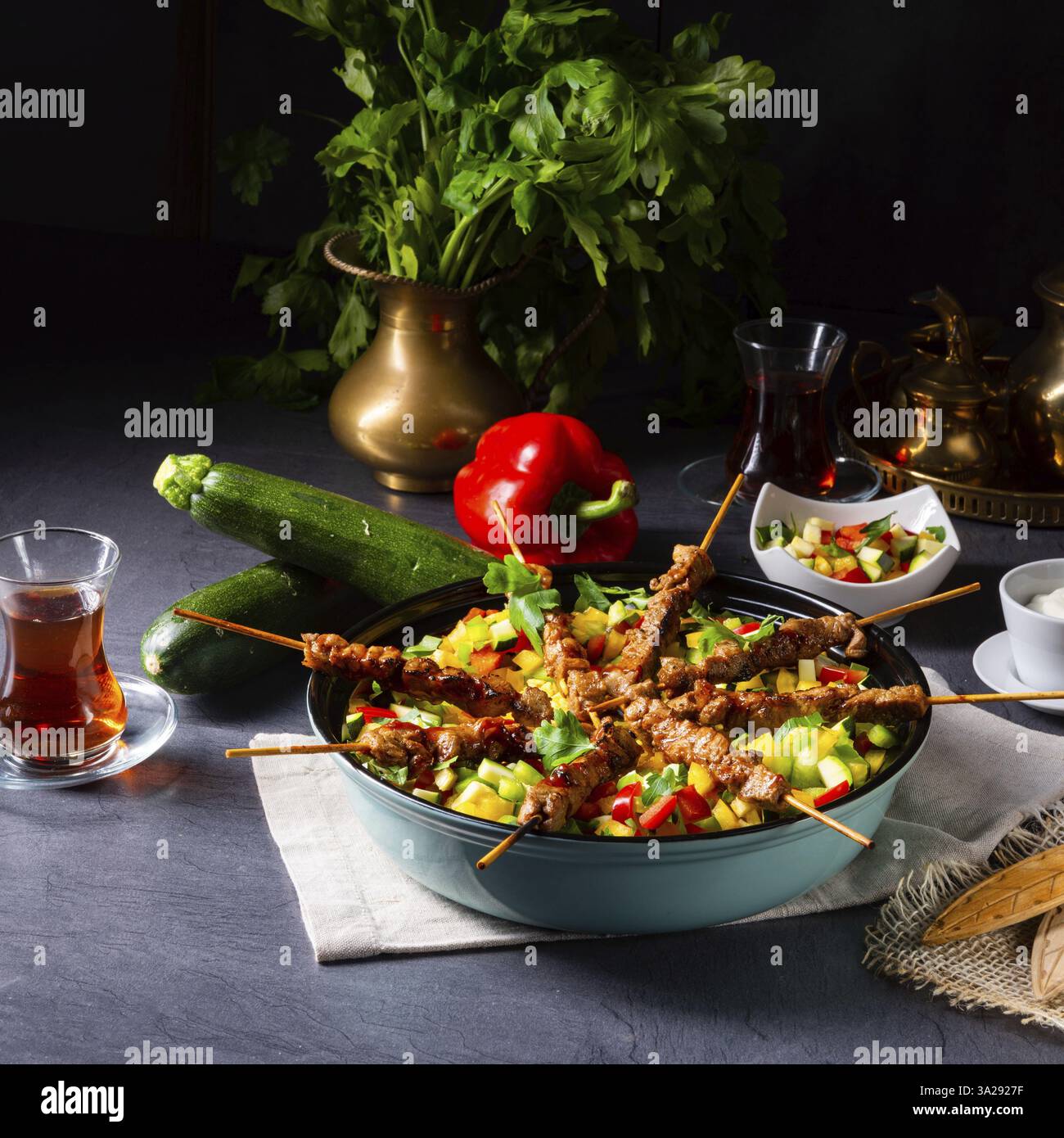 Lamb kebabs with curry rice and various vegetables Stock Photo - Alamy