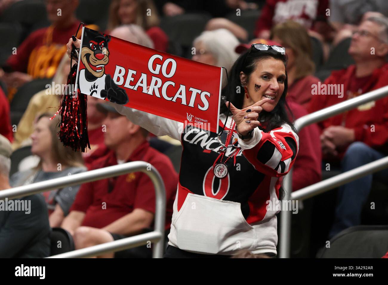 KANSAS CITY, MO - MARCH 12: A Cincinnati Bearcats holds a Go Bearcats sign in the second half of ...