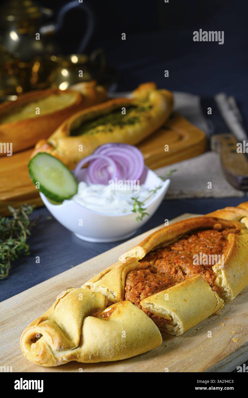 Pide with minced meat, spinach, feta and feta cheese Stock Photo - Alamy