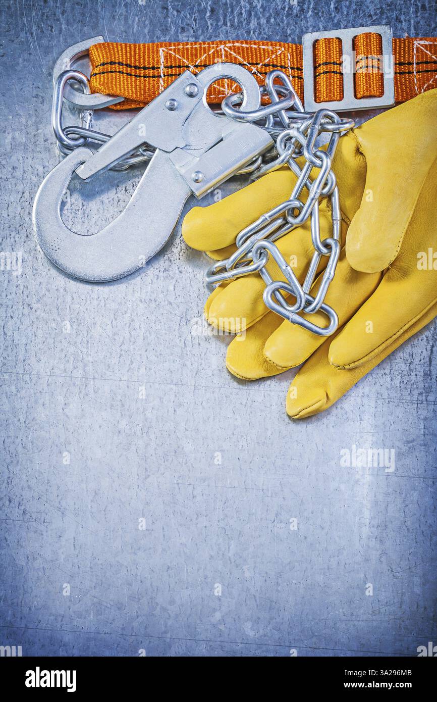 Safety construction body belt leather protective gloves on scratched ...