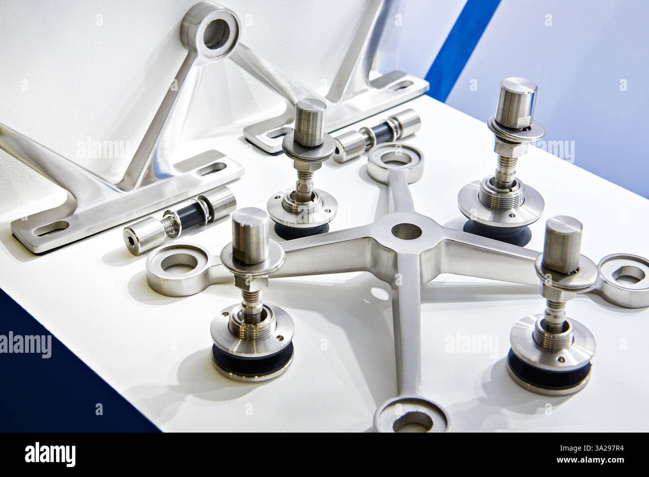 Metal parts for fastening glass in the store Stock Photo - Alamy
