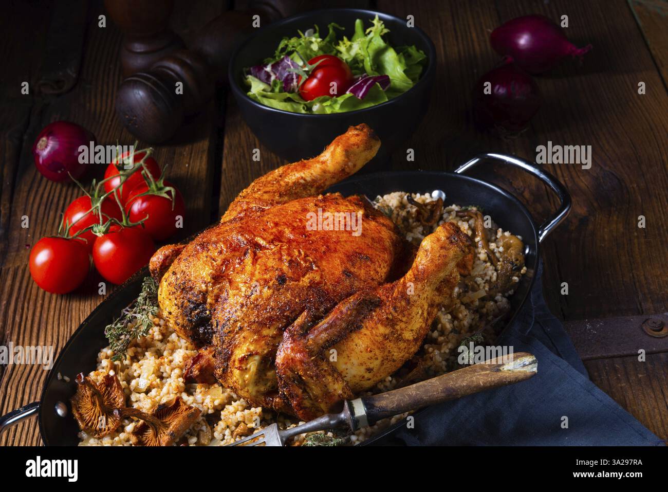 Grilled spicy chicken with pearl barley and mushrooms Stock Photo - Alamy