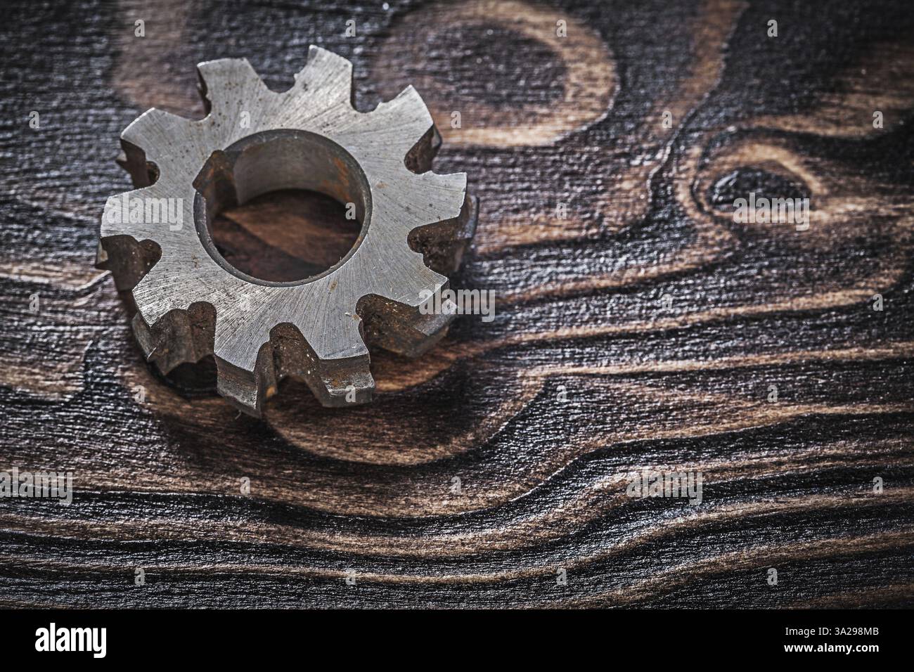 Rough rotary cutter on vintage wood board top view construction concept ...