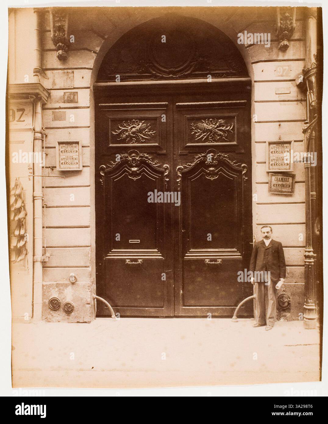 This photograph by Eugène Atget shows the entrance of Hôtel de Ségur at ...