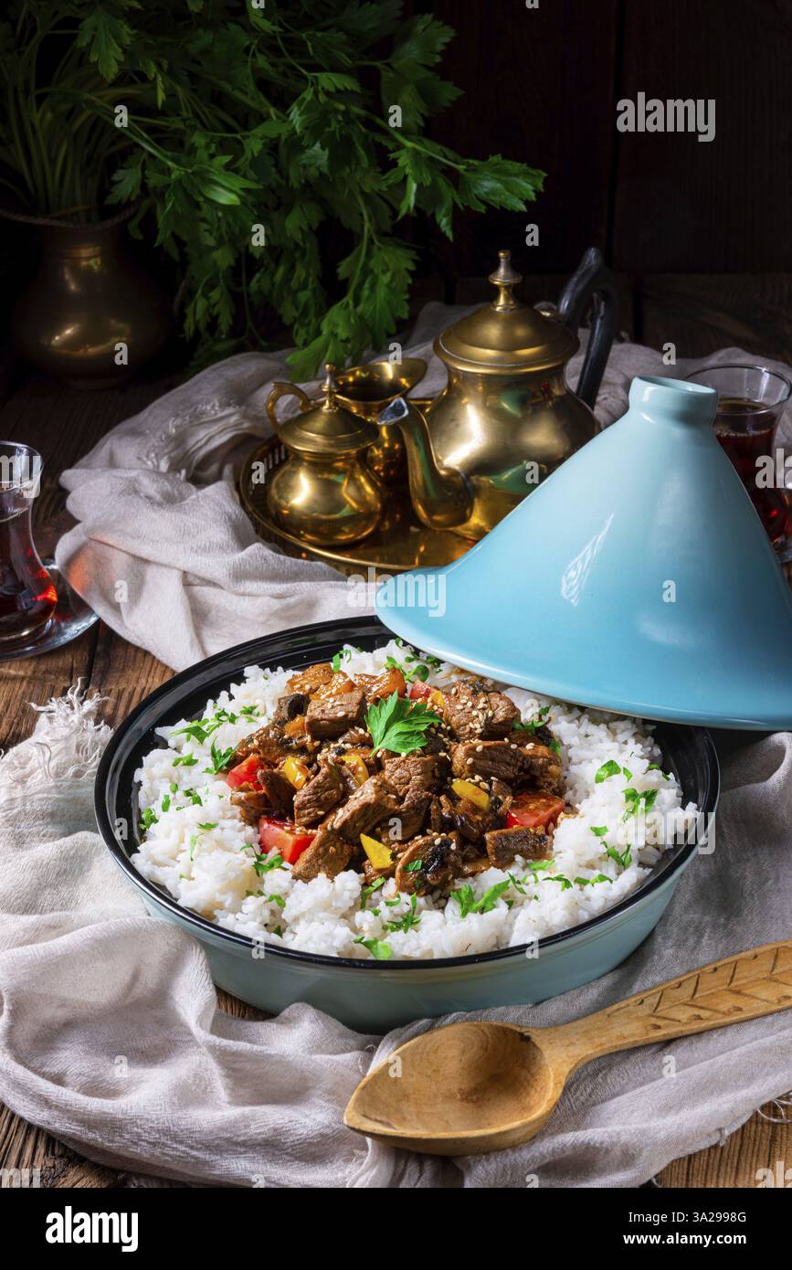 Tajin beef stew with rice, peppers and sesame seeds Stock Photo - Alamy