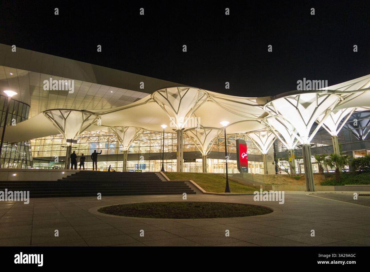 Split Airport at night and illuminated; front facade of the main ...