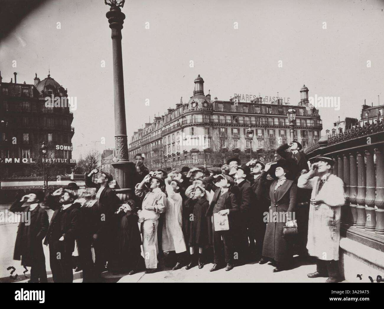 A dramatic photograph of Place de la Bastille during the eclipse on April 17, 1912, capturing ...