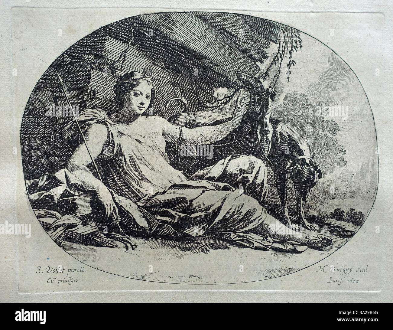 Diana is shown sitting on the ground with an arrow in her right hand ...