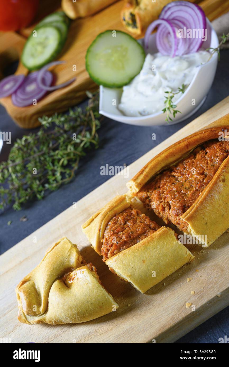 Pide with minced meat, spinach, feta and feta cheese Stock Photo - Alamy