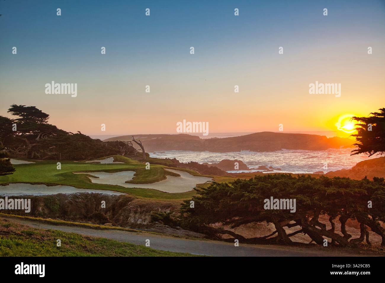 CYPRESS POINT GOLF COURSE California, USA - The sin sets over the ...