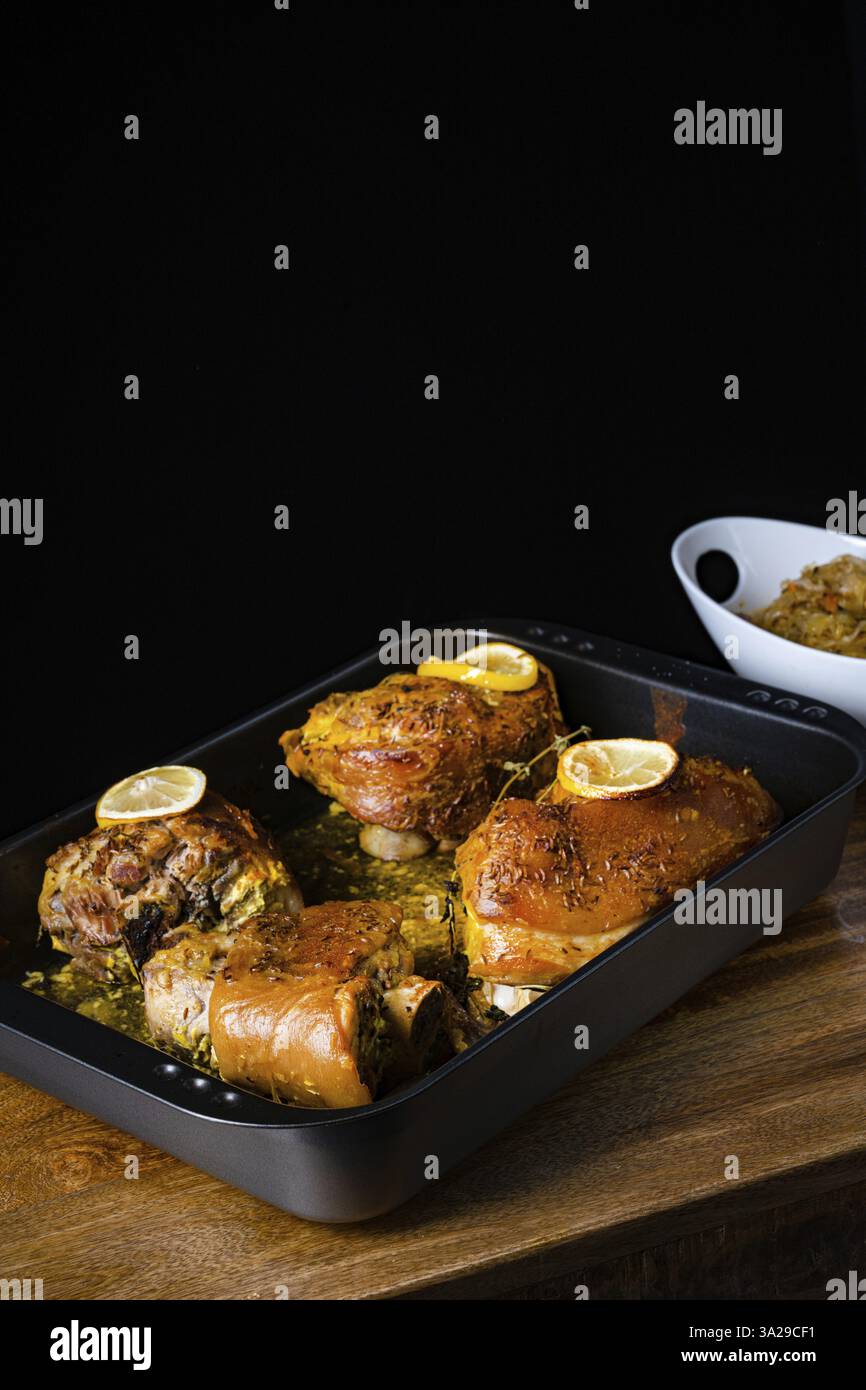 Crispy roasted pork bones from the oven Stock Photo - Alamy