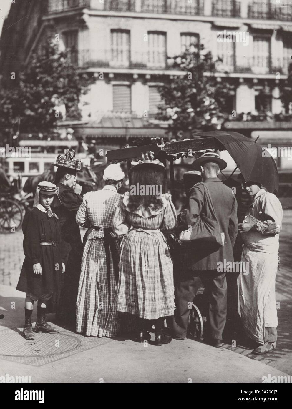 This photograph by Eugène Atget shows a street scene from Rue ...