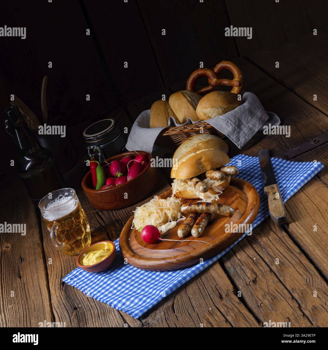 Rustic Thuringian bratwurst with sauerkraut and roll Stock Photo - Alamy