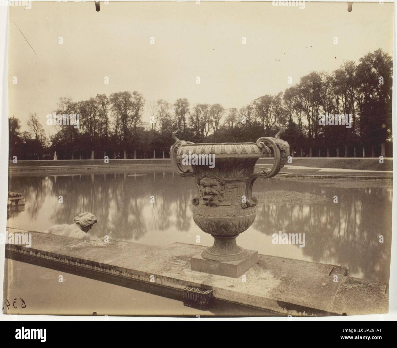 This photograph by Eugène Atget shows the Bassin de Neptune at ...