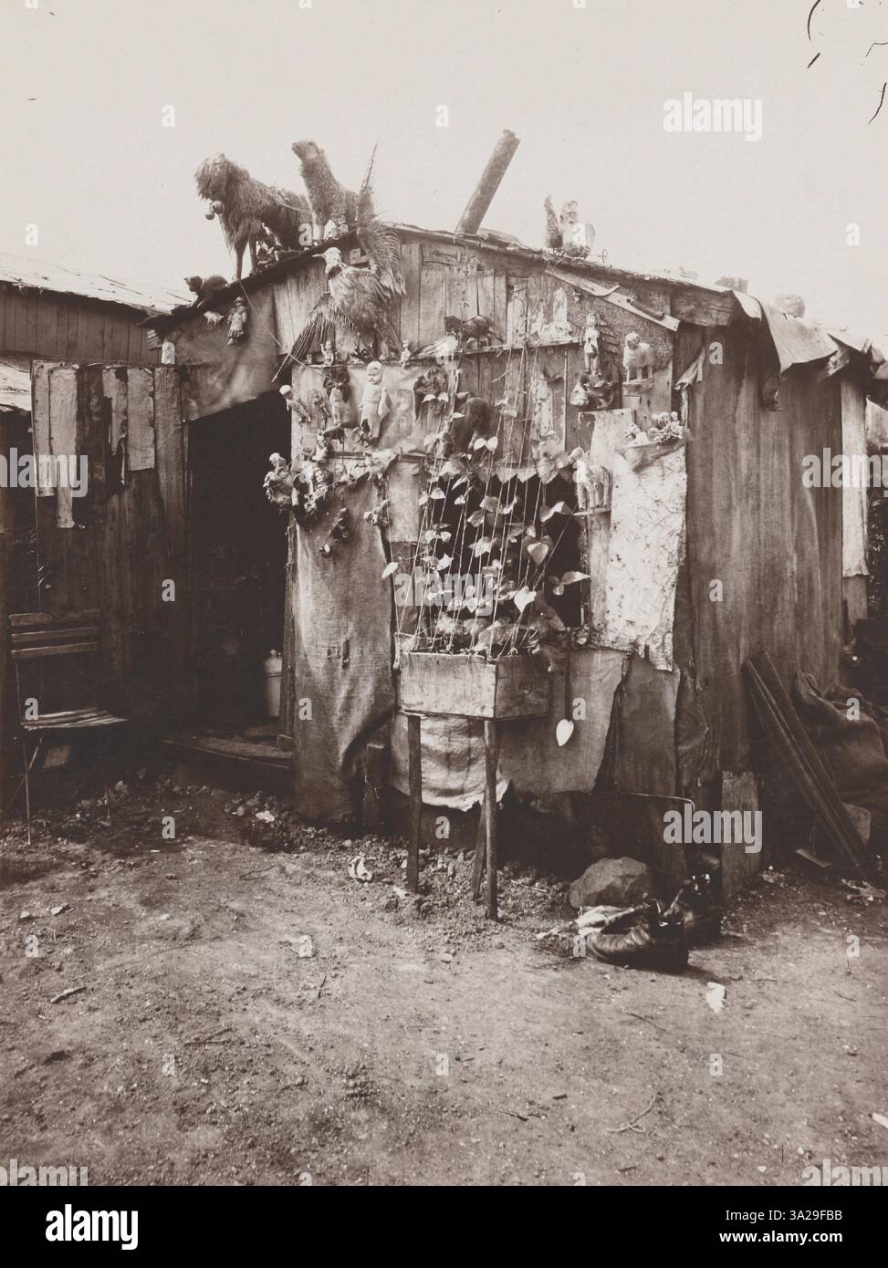 This photograph captures a ragpicker (chiffonier) in Paris, focusing on ...