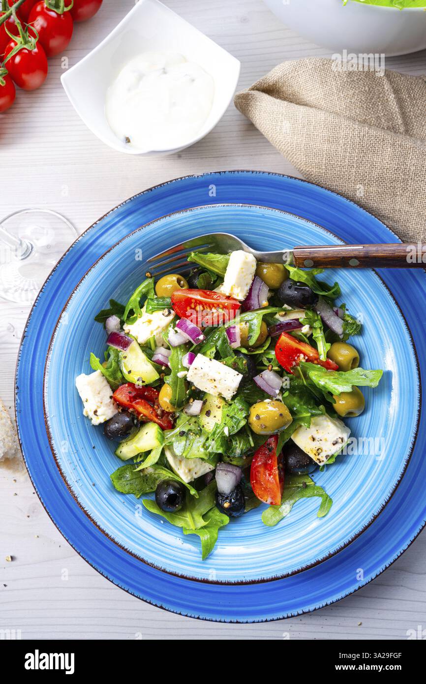 Rustic Greek salad with feta cheese Stock Photo - Alamy