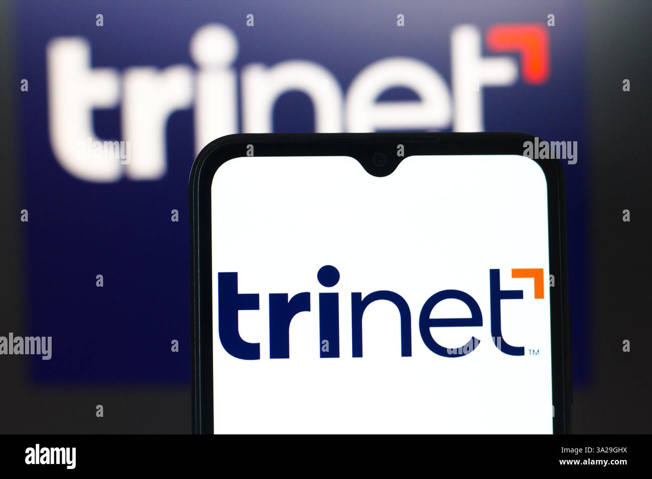 In this photo illustration, the TriNet Group logo is seen displayed on ...