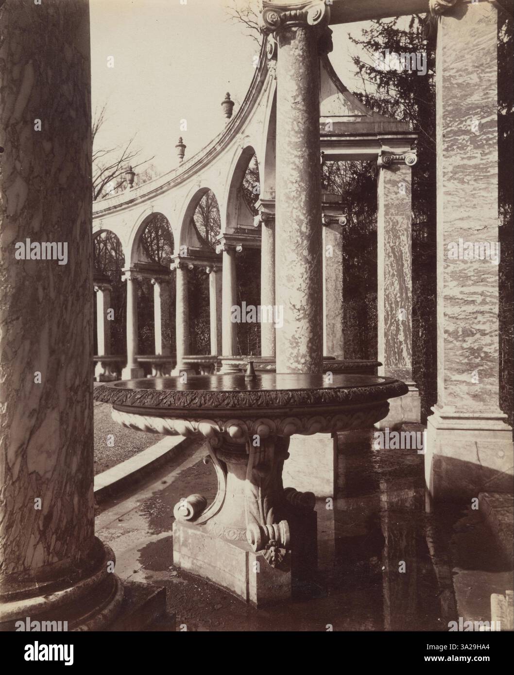 This photograph captures the Grove of the Colonnade at Versailles ...