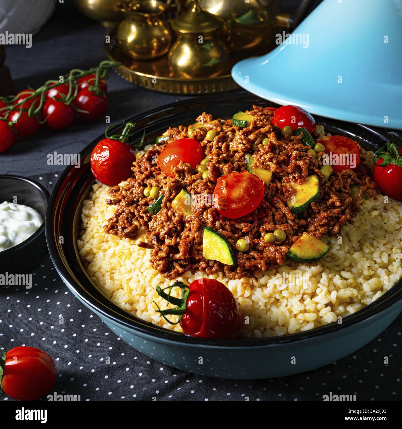 Tomato bulgur with vegetables and minced meat Stock Photo - Alamy