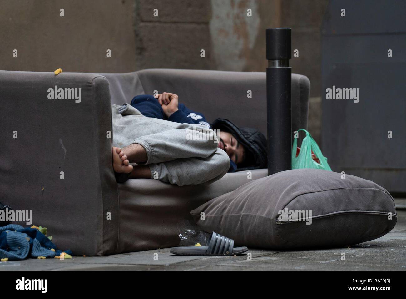A homeless person, in the Raval neighborhood of Barcelona, on March 12 ...