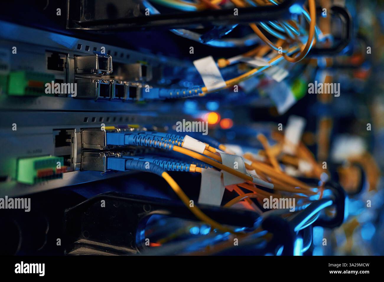 Blue and yellow wires. Close up view of hardware in the server room ...