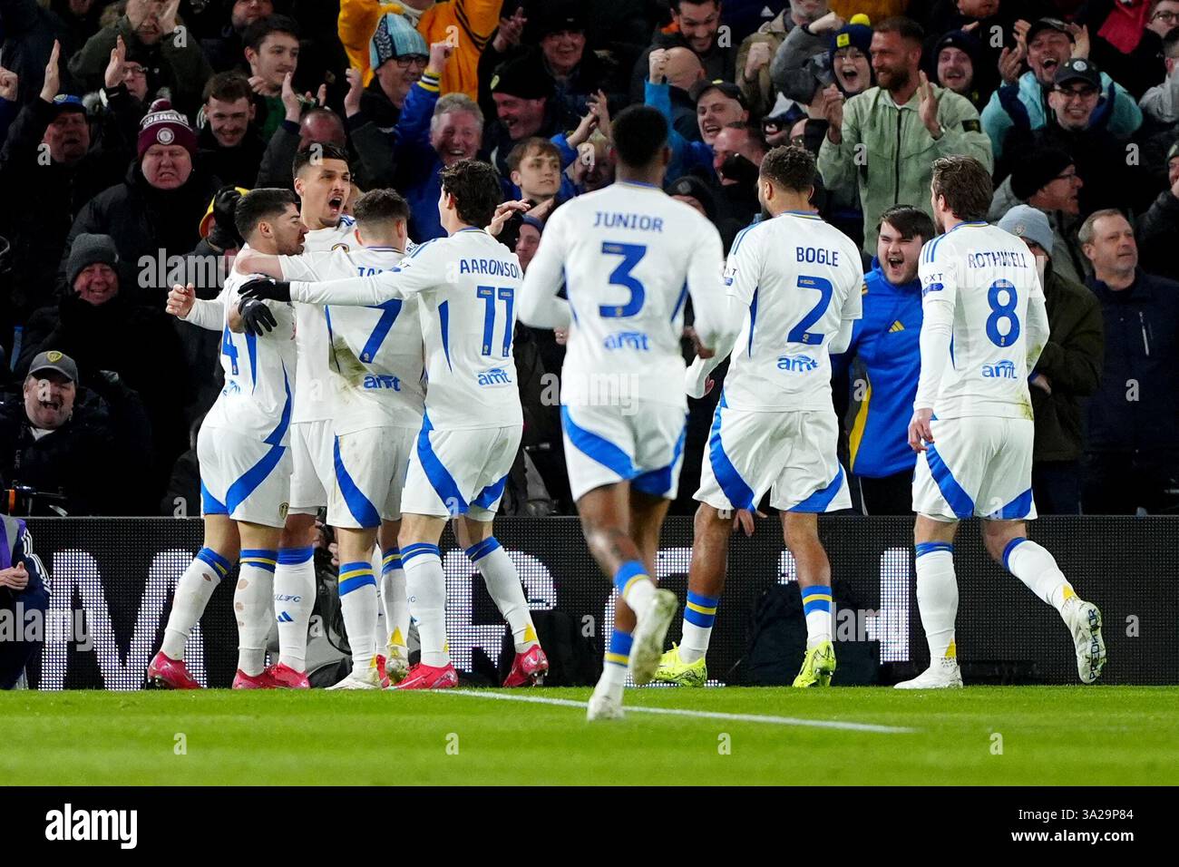 Leeds United's players celebrate after their side took the lead through ...