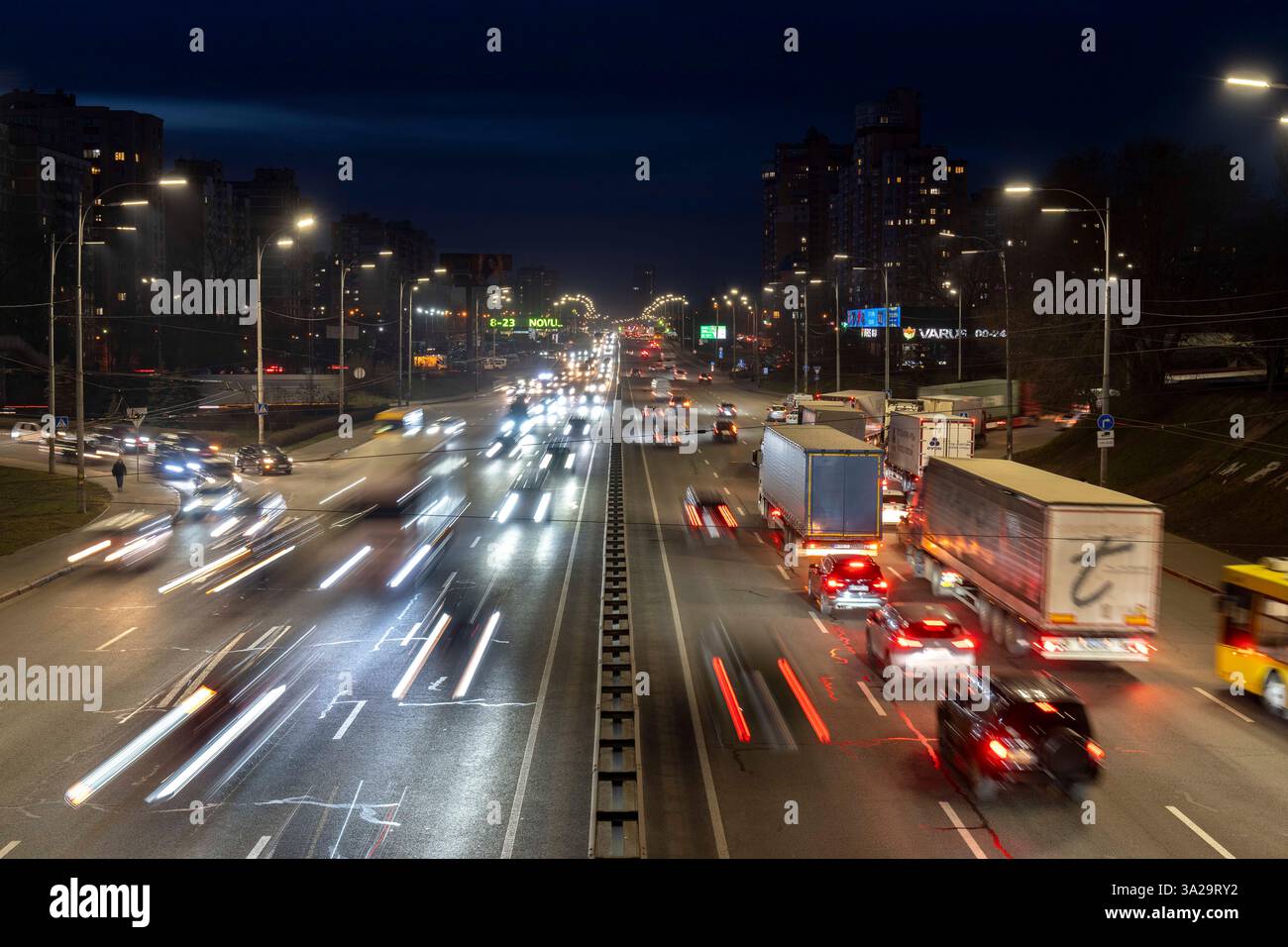 Long exposure of evening traffic on Highway M07 in Kyiv, Ukraine. The ...